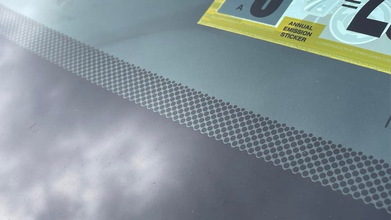 Here's Why Your Windshield Has Those Little Black Dots Around It
