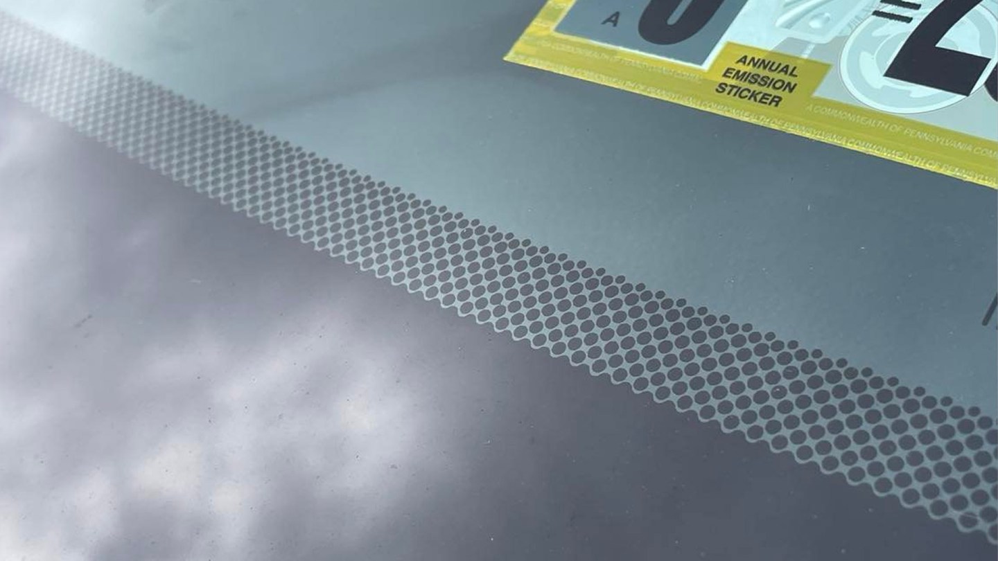 Here's Why Your Windshield Has Those Little Black Dots Around It