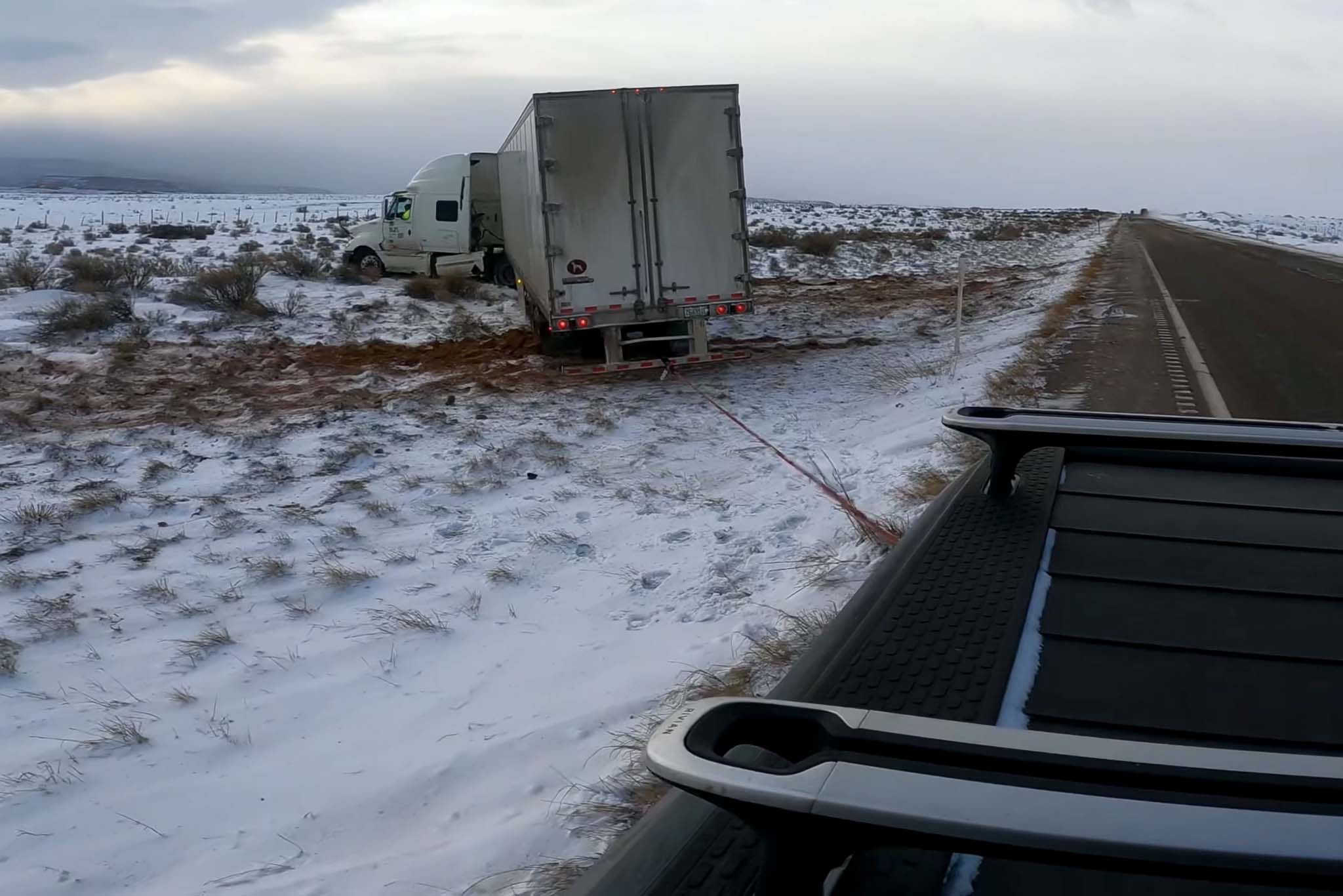 Rivian R1T Yanks 38,000-Pound Semi-Truck and Trailer Out of the Snow