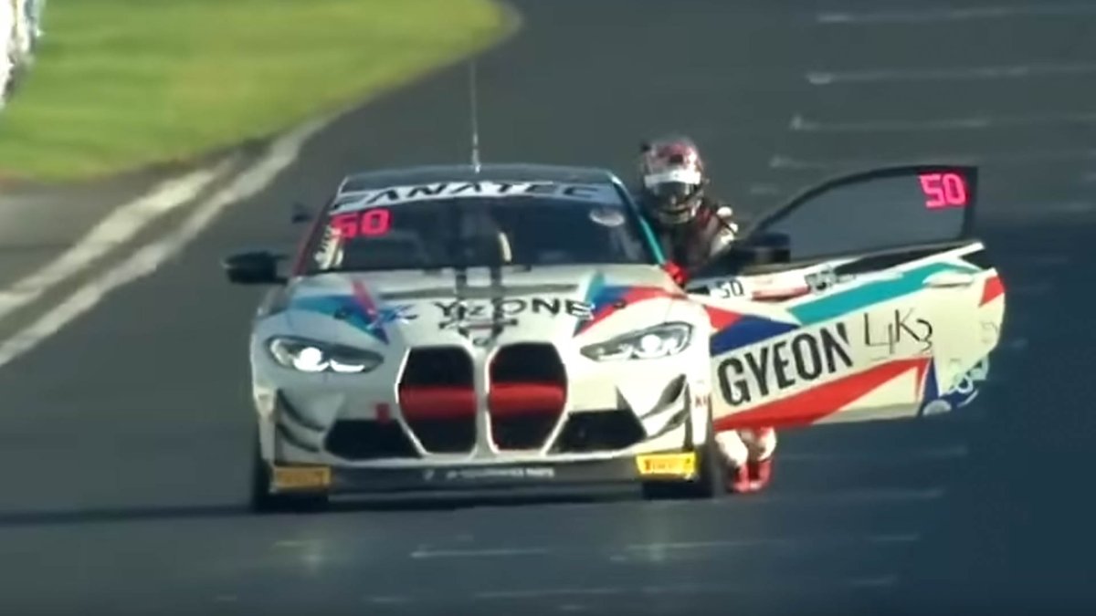 Tenacious Race Car Driver Pushes Stalled BMW Across the Line