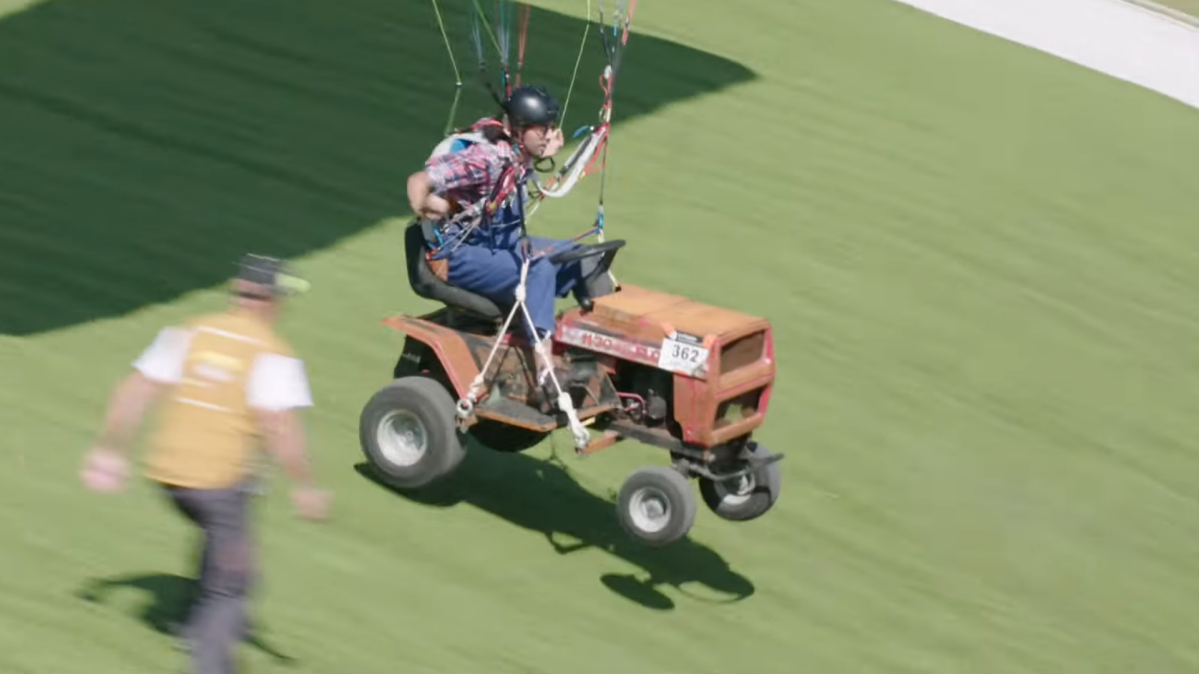 Watch a Very Brave Man Fly a Lawn Tractor High Above the Alps