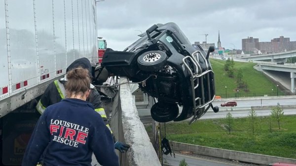 Incredibly Quick Crane Rescue Saves Semi-Truck Driver Dangling off Bridge