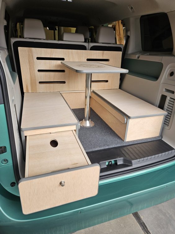 Nifty VW ID Buzz Camper Kit Stuffs a Picnic Table Into the Back of the Van