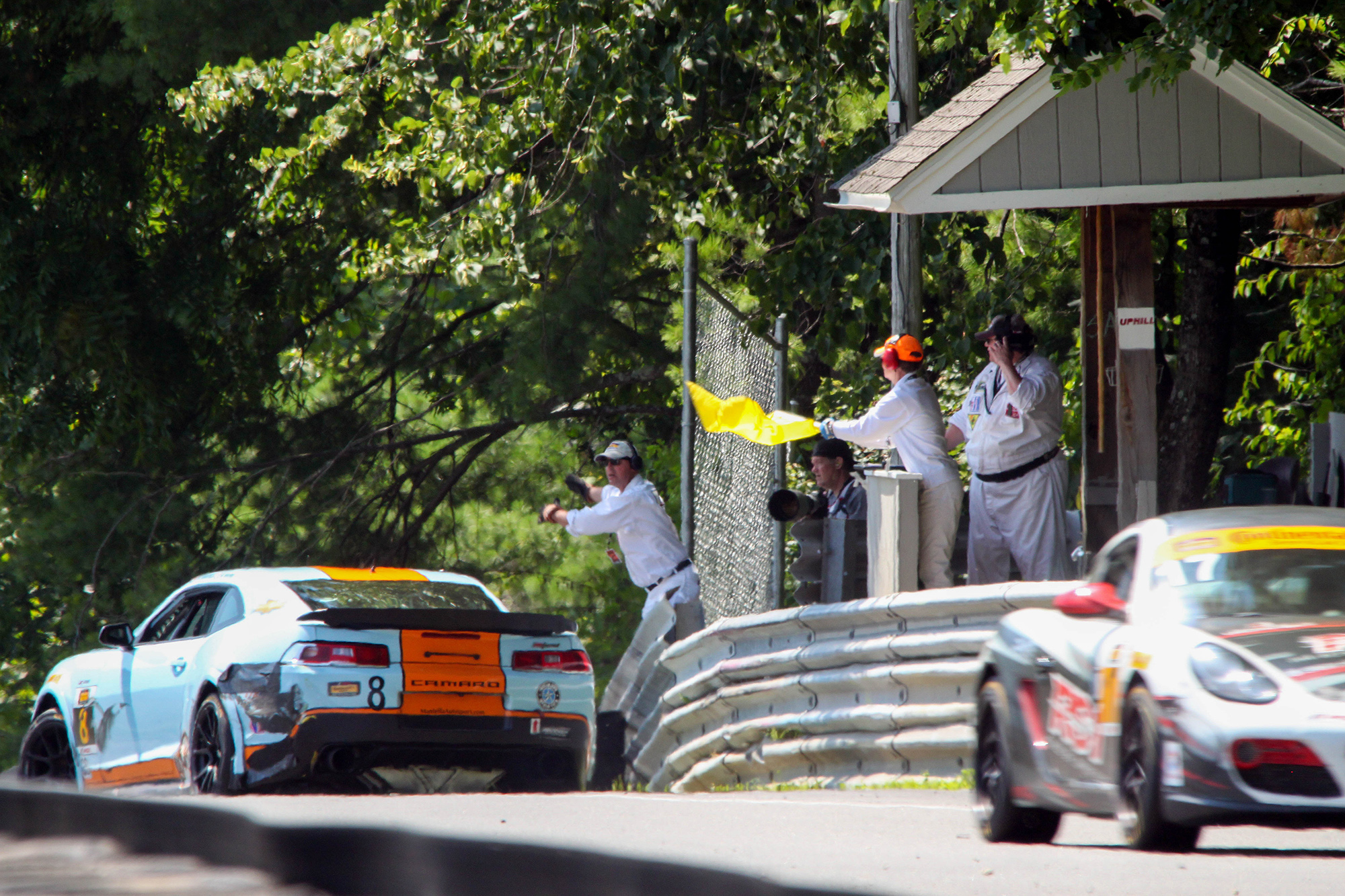 The Roadies of Racing: Inside the Dying Culture of Track Corner Workers