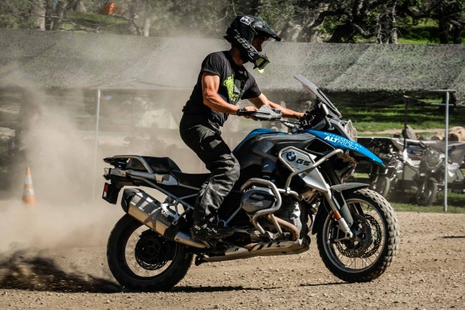 Watch a Motorcyclist Knock Out Two Guys Picking a Fight