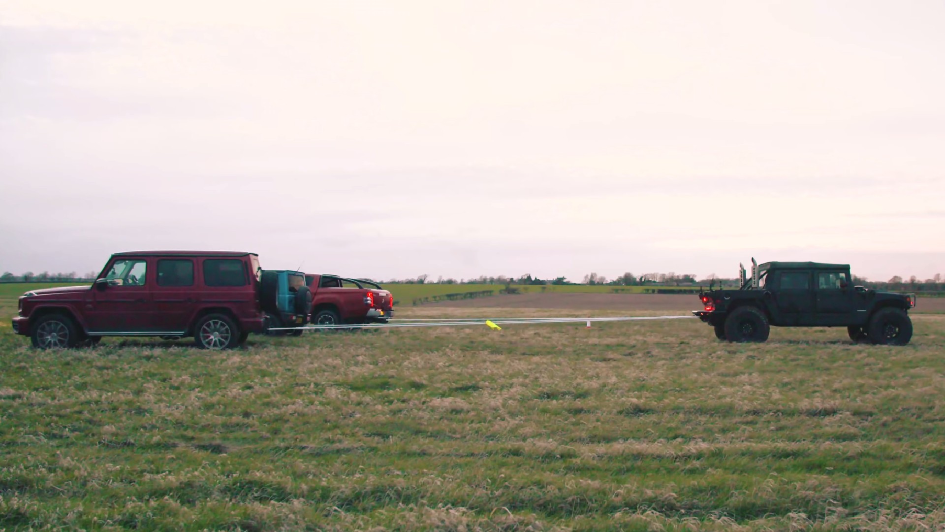 There's No Match for a Brutish Hummer in This Three-on-One Tug of War