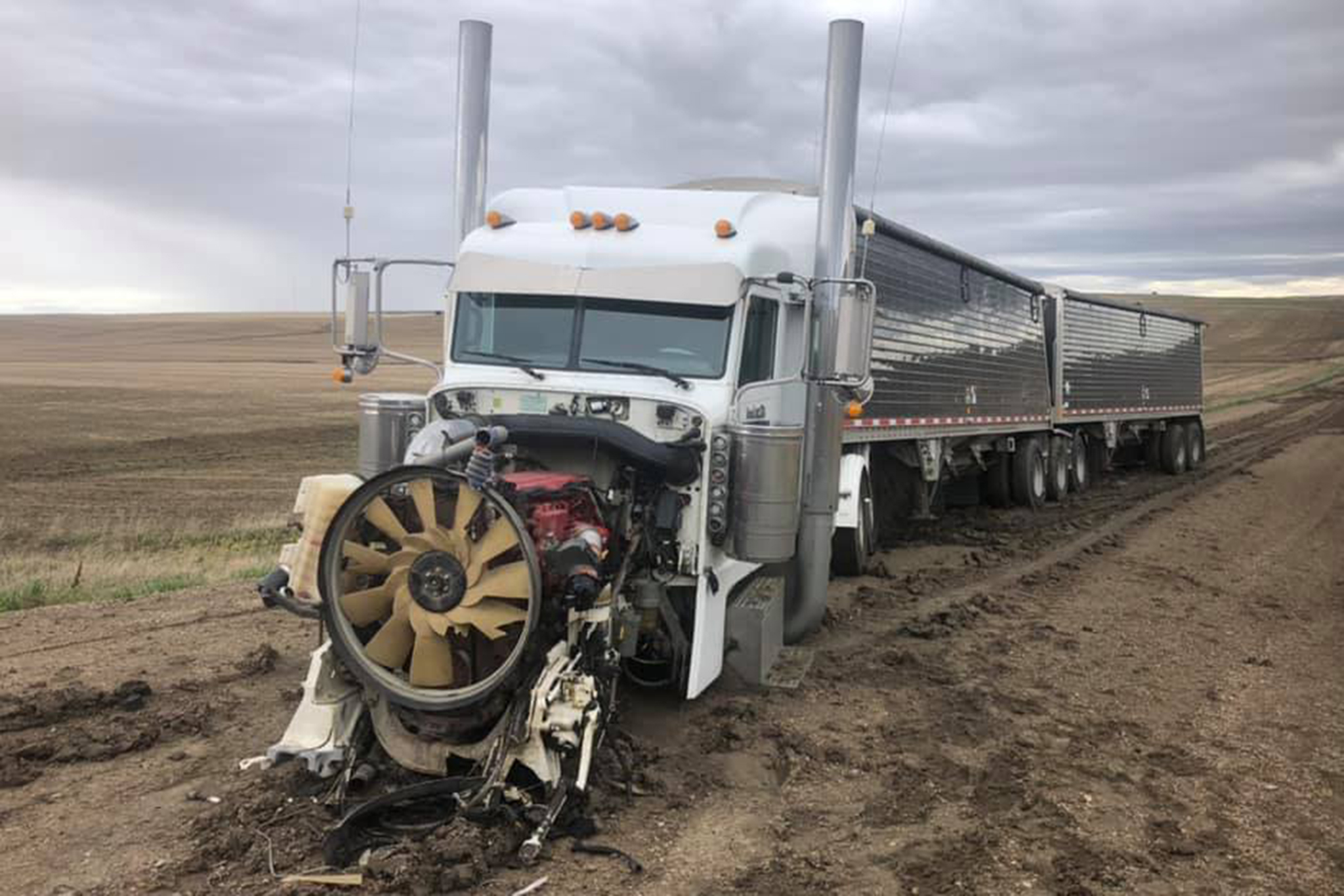 This Amateur Attempt to Rescue a Stuck Semi-Truck Ended in Total Disaster